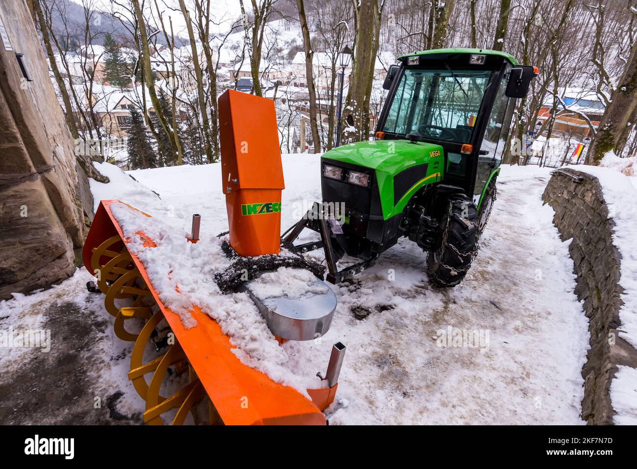 Snow plow truck in winter on path. Green color and modern design Stock ...