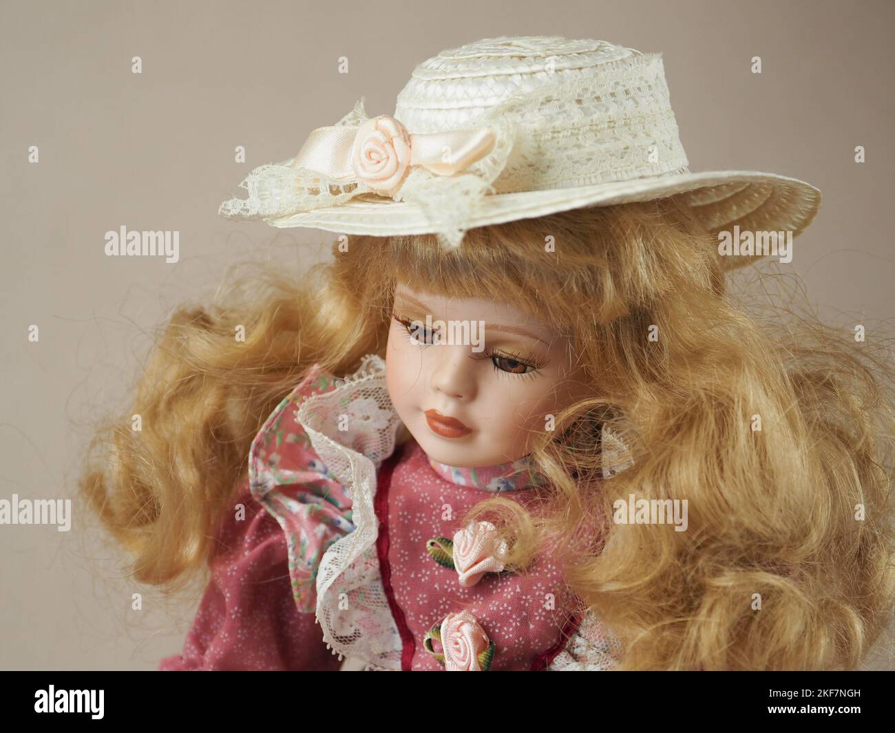 Vintage porcelain doll golden-haired girl with flowing hair with brown ...