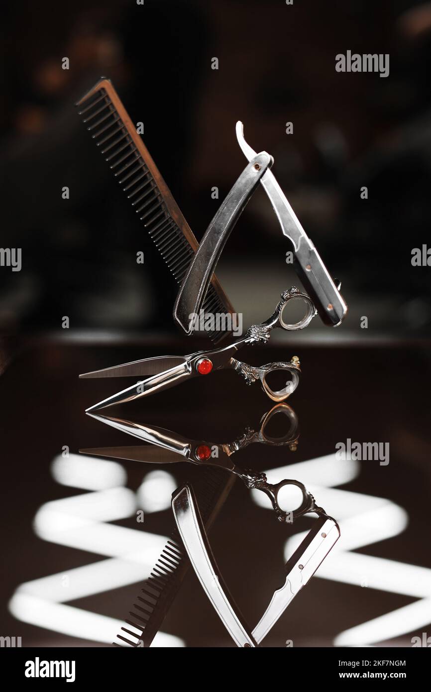 Barber shop equipment sets on dark glass background. Comb, steel ...