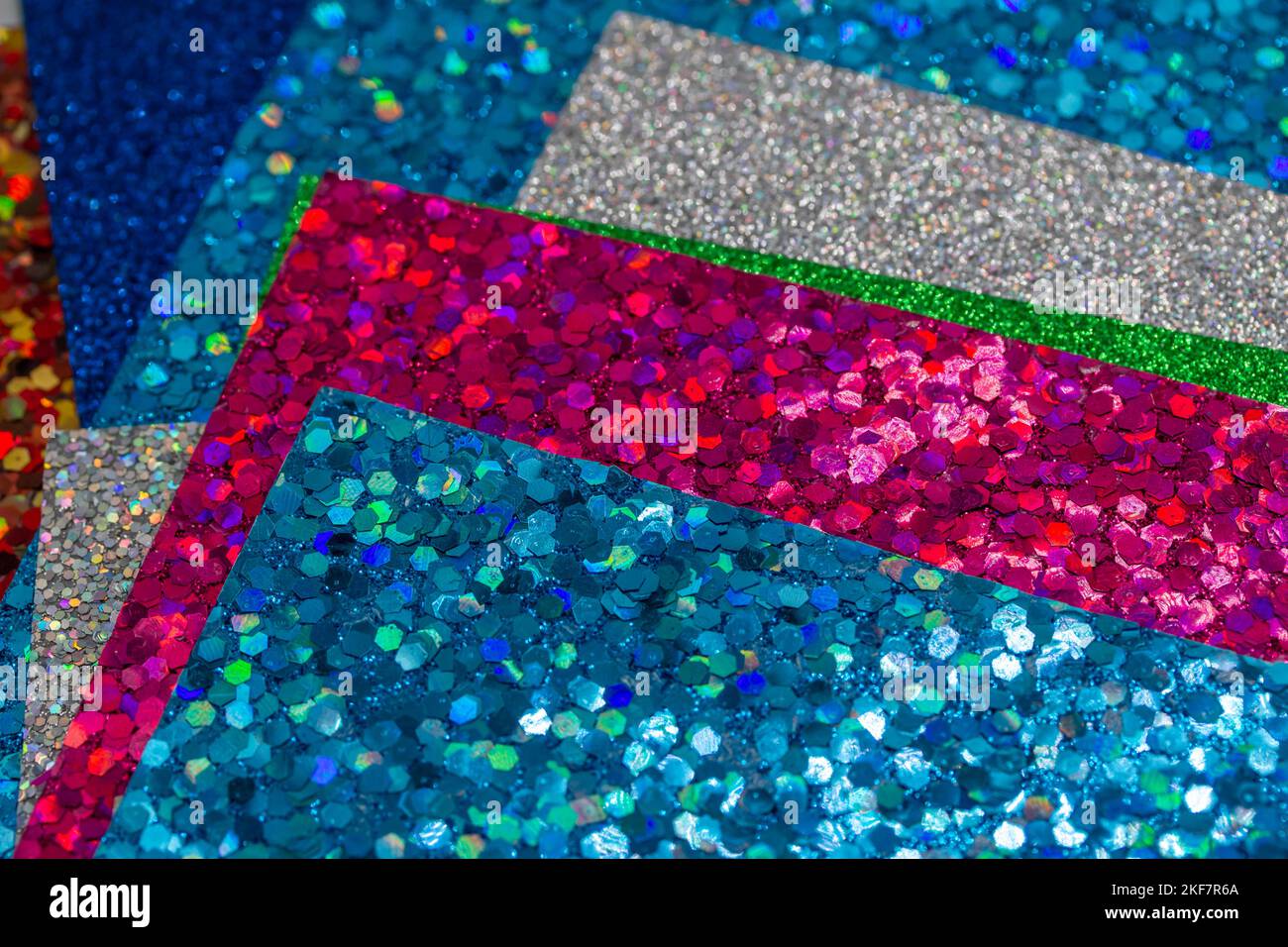 Colorful macro layers of various hued sparkling glitter texture ...