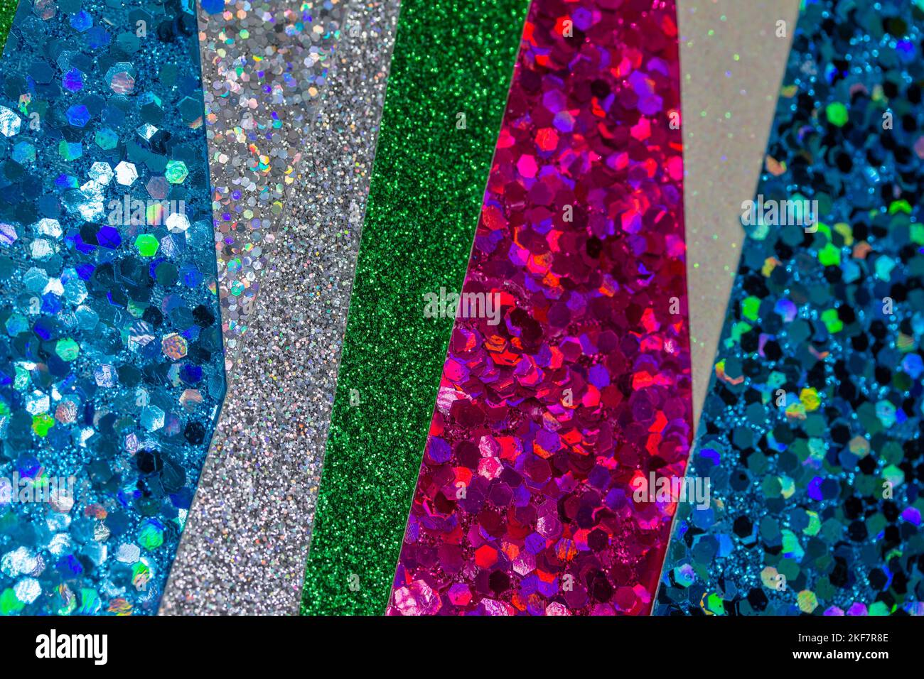 Colorful macro layers of various hued sparkling glitter texture ...