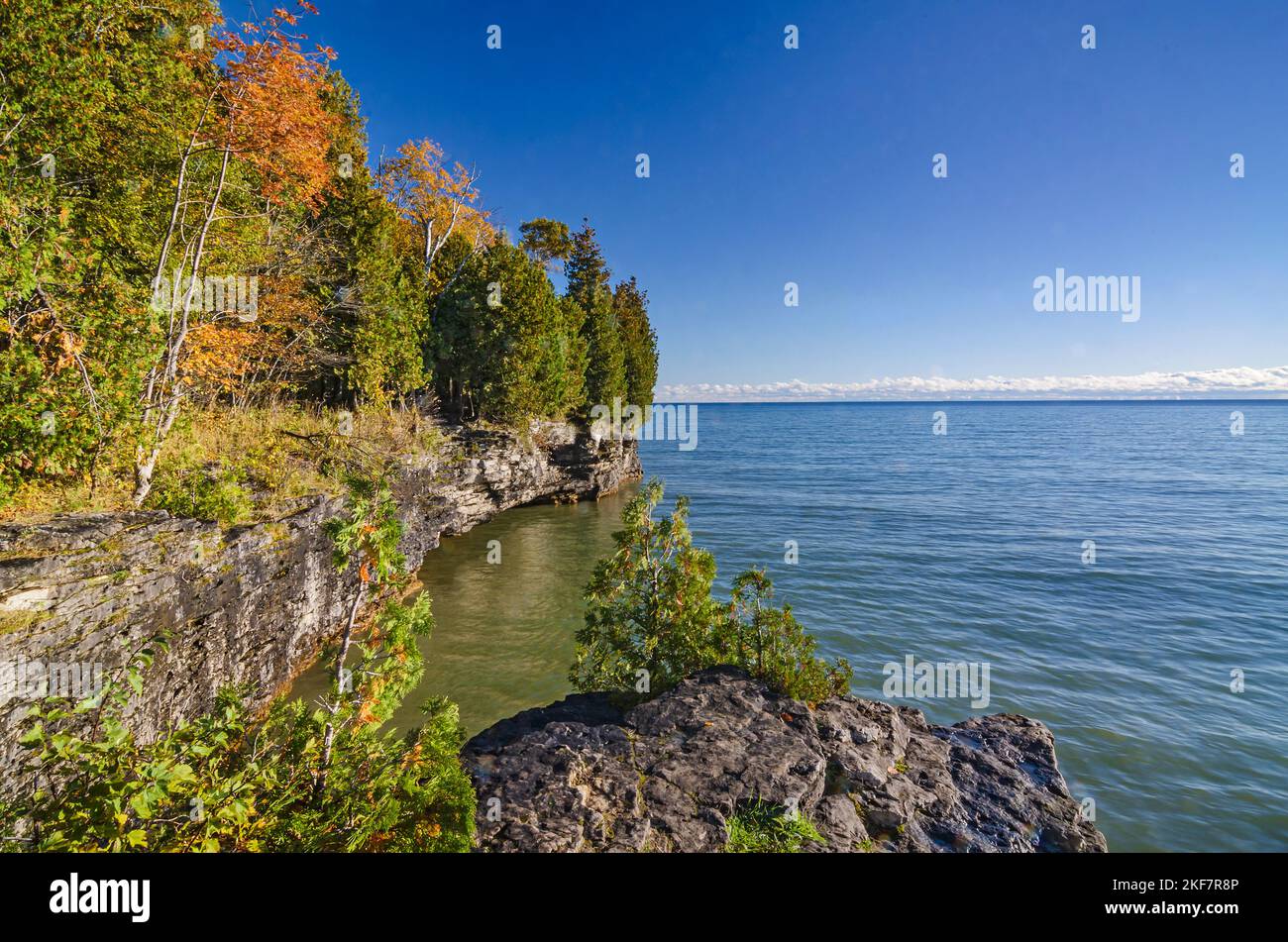 The Lake Michigan shore at Cave Point County Park shows autumn color ...