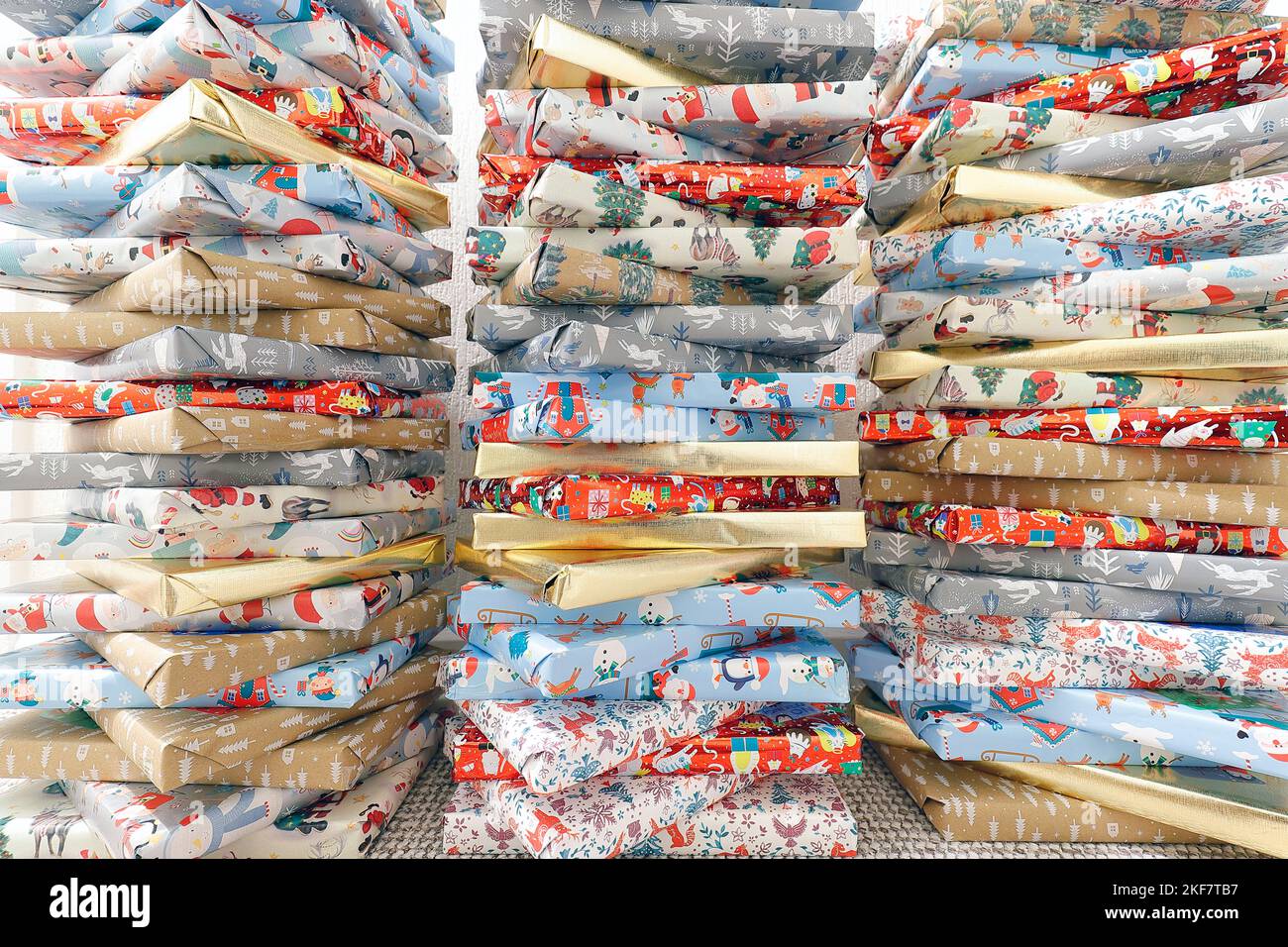 Rows of wrapped Christmas presents stacked on top of each other Stock ...
