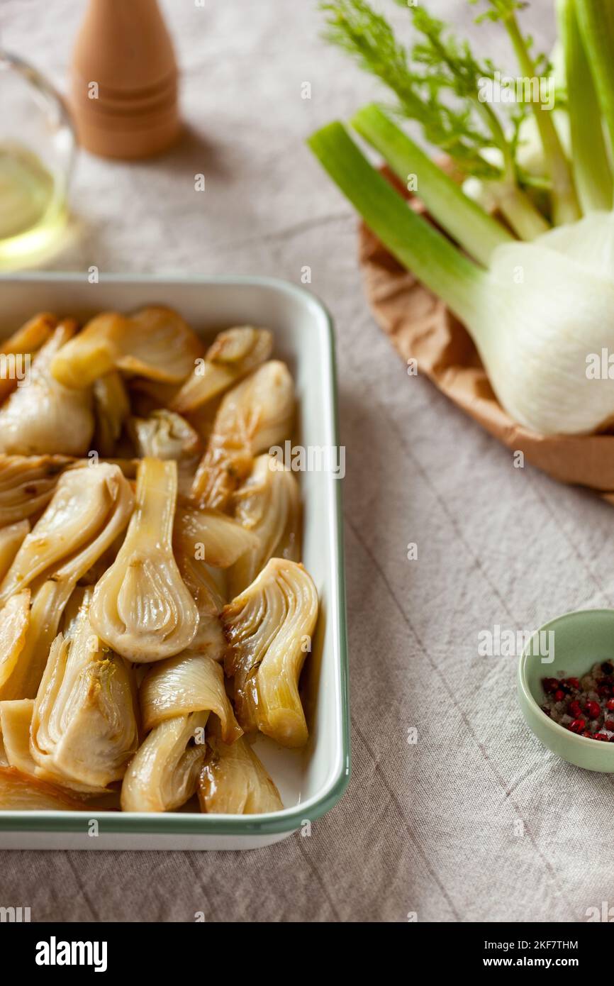 baked fennel dish on a kitchen table Stock Photo - Alamy