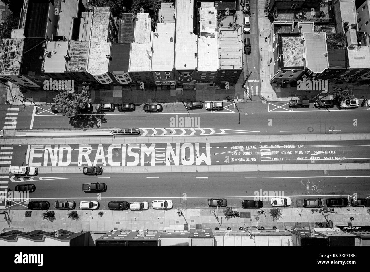 An aerial grayscale of Philadelphia cityscape with a ground Mural "End ...