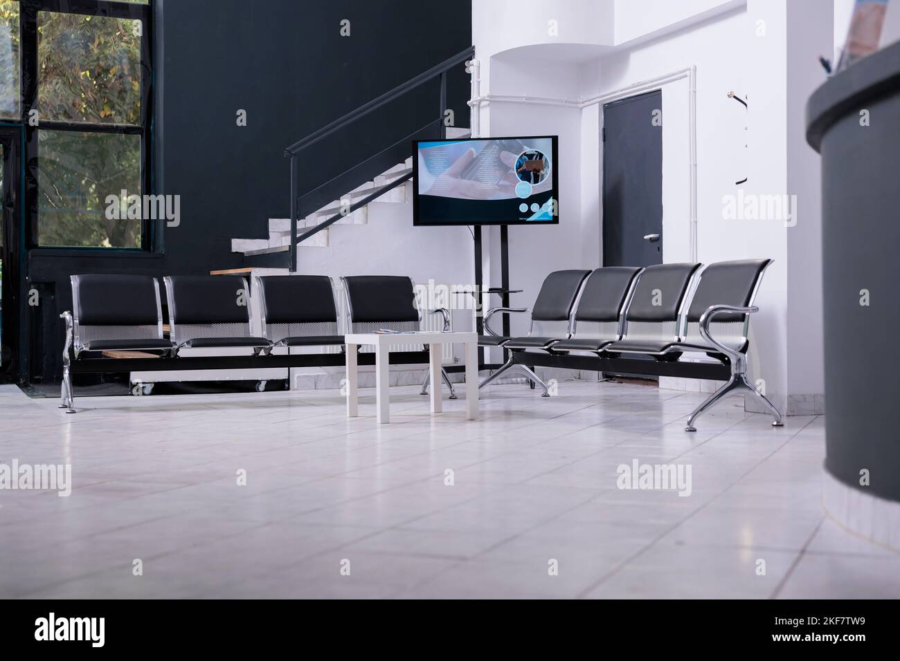 interior of empty hospital lobby with big windows waiting for patients ...