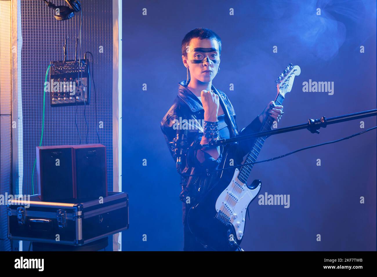 Female musician clenching fists and being aggressive, acting violent ...