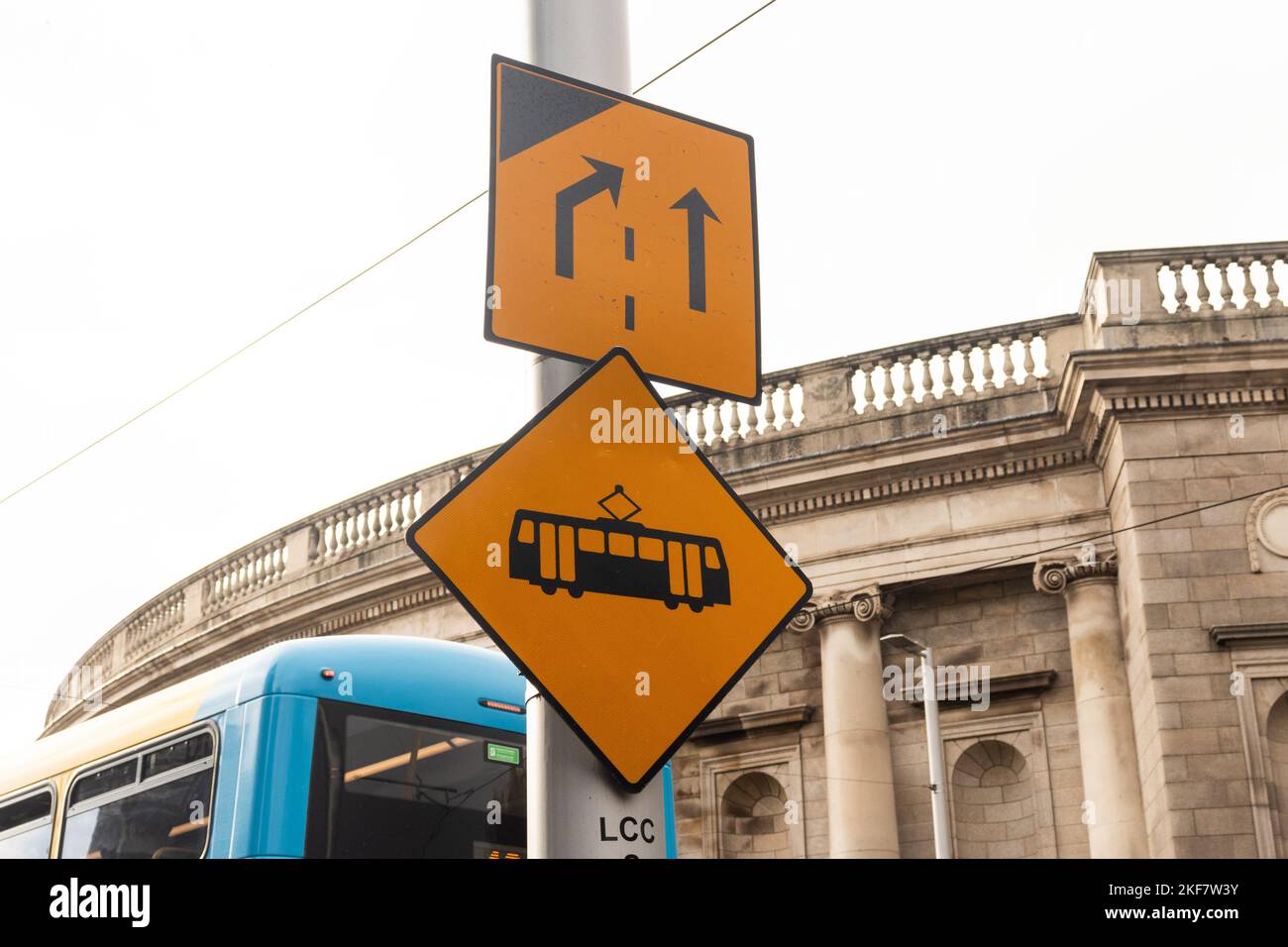 Yellow Traffic road sign narrowing of the road, turn right, straight ...