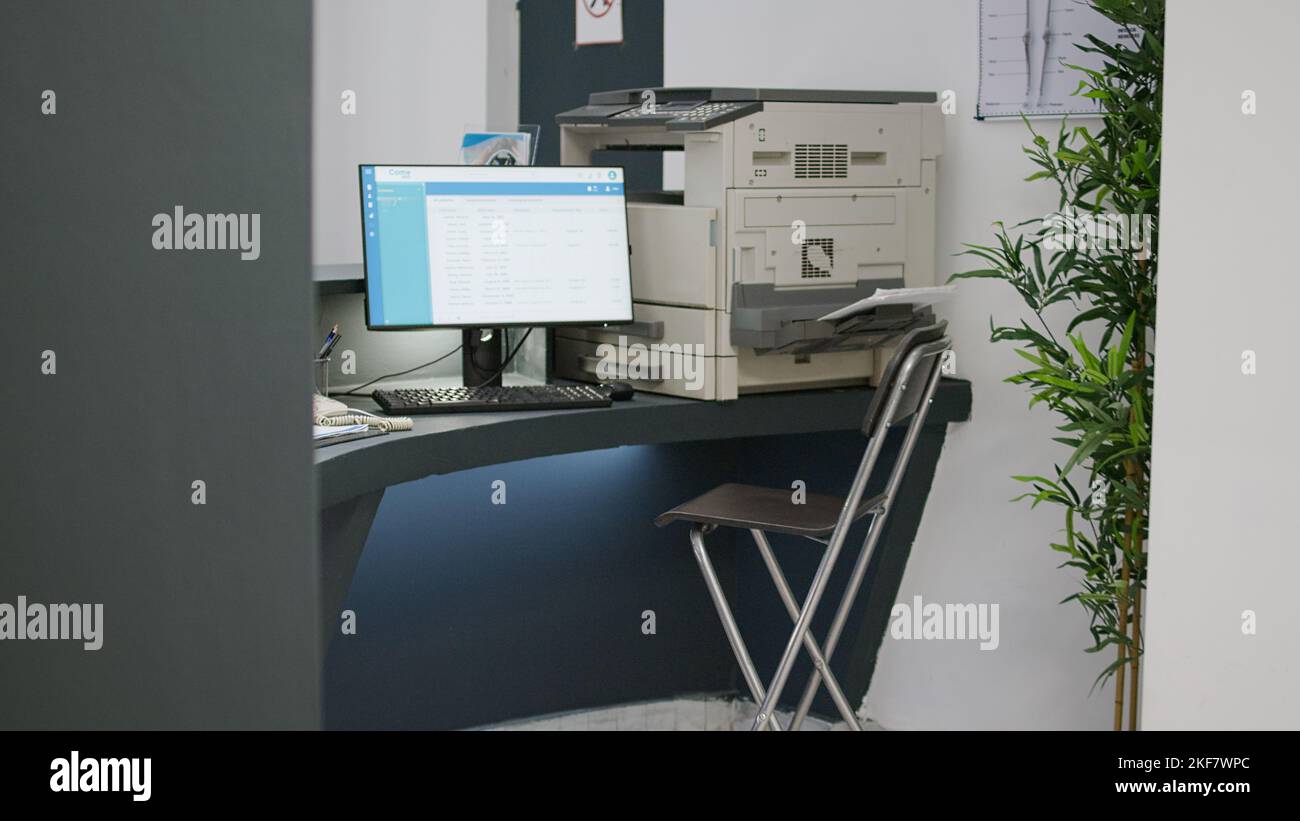 Hospital registration desk with appointment forms on computer, checkup ...