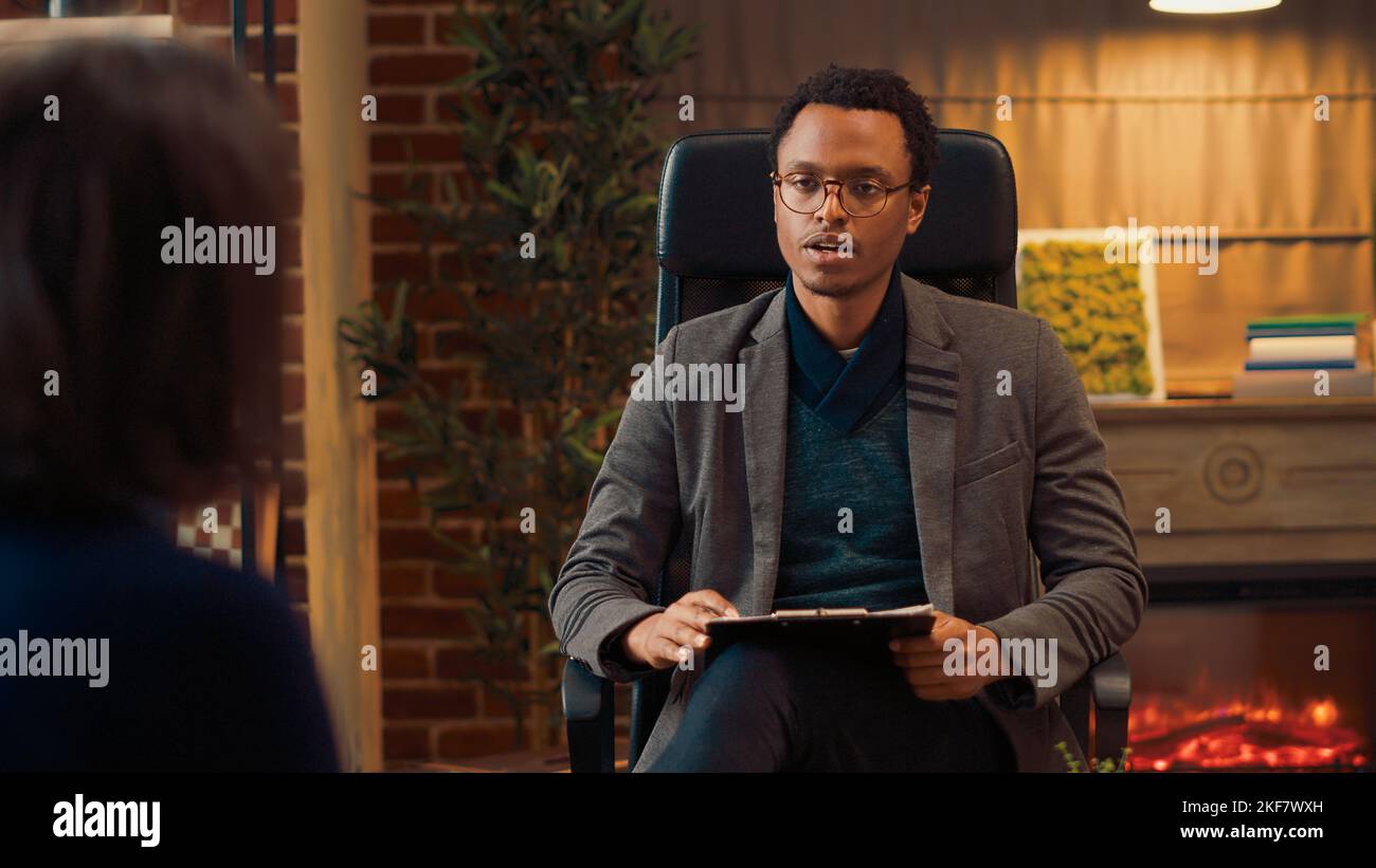 African american counselor listening to couple at therapy session ...