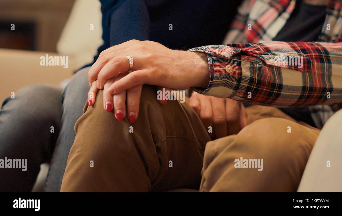 Married couple holding hands after reconciliation at couple therapy ...