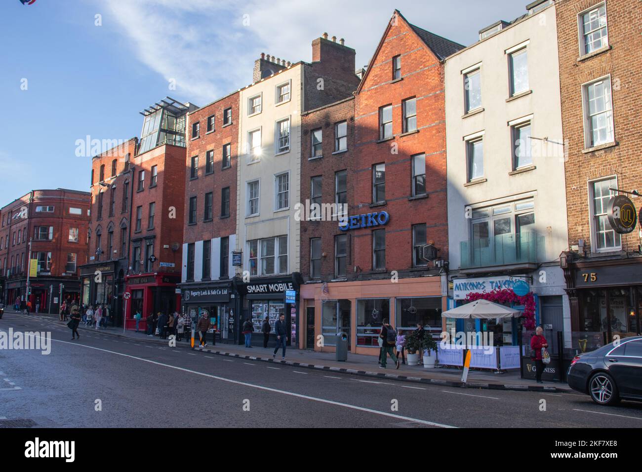 DUBLIN, IRELAND - October 20, 2022: Busy street in Dublin with typical ...