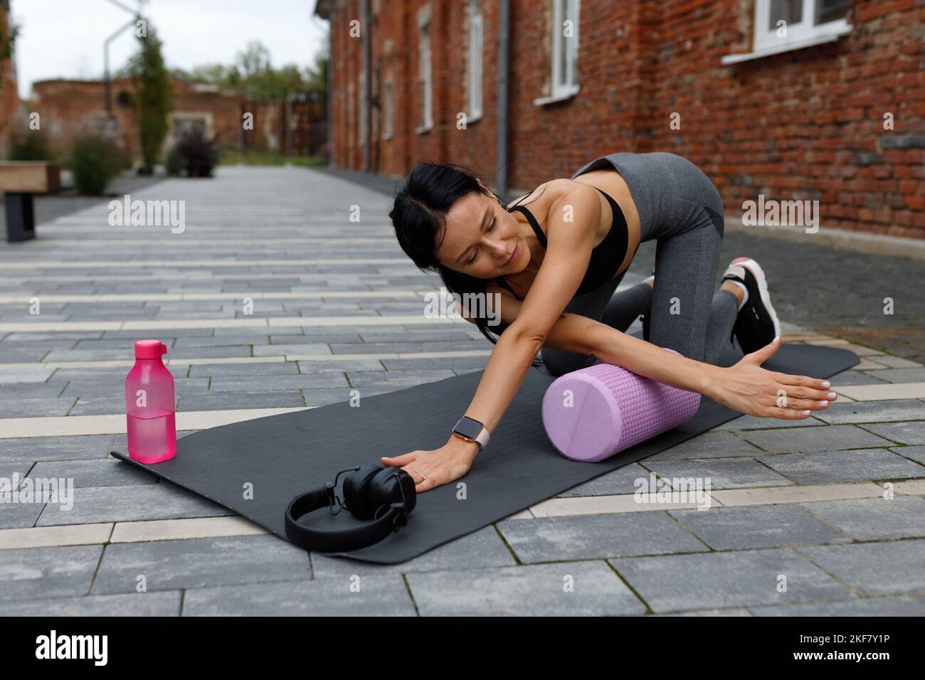 Woman using body roller hi-res stock photography and images - Alamy