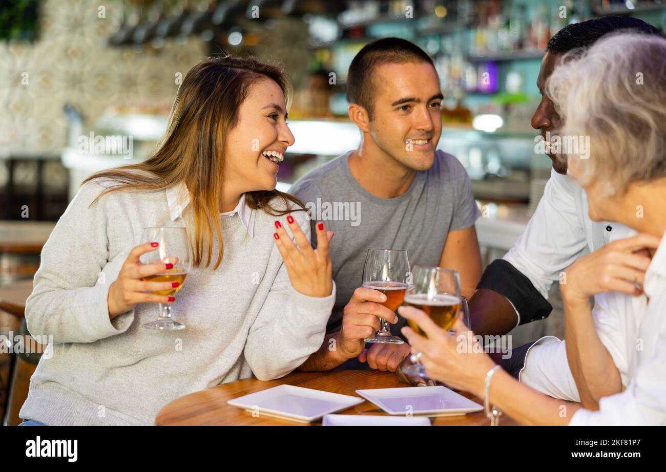 View on the young Latin couple talking Stock Photo - Alamy