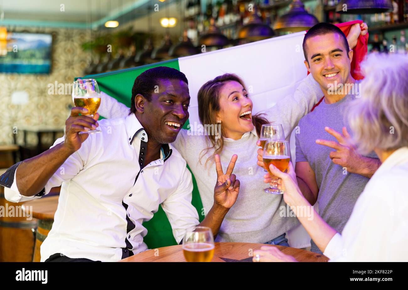 Diverse group celebrating with Italian flag Stock Photo - Alamy