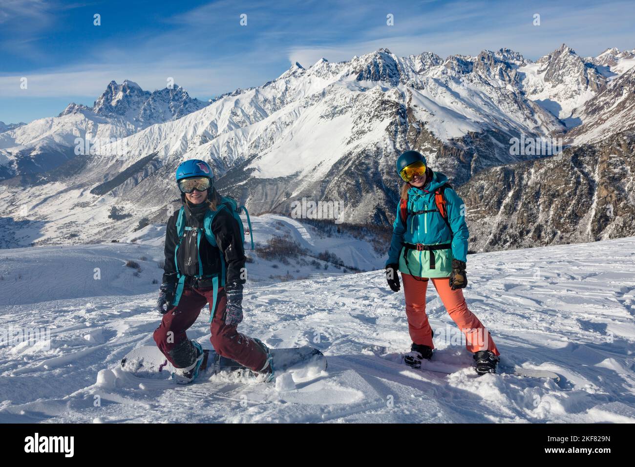 Happy Girls have fun on a snowboarding vacation at a ski resort in ...