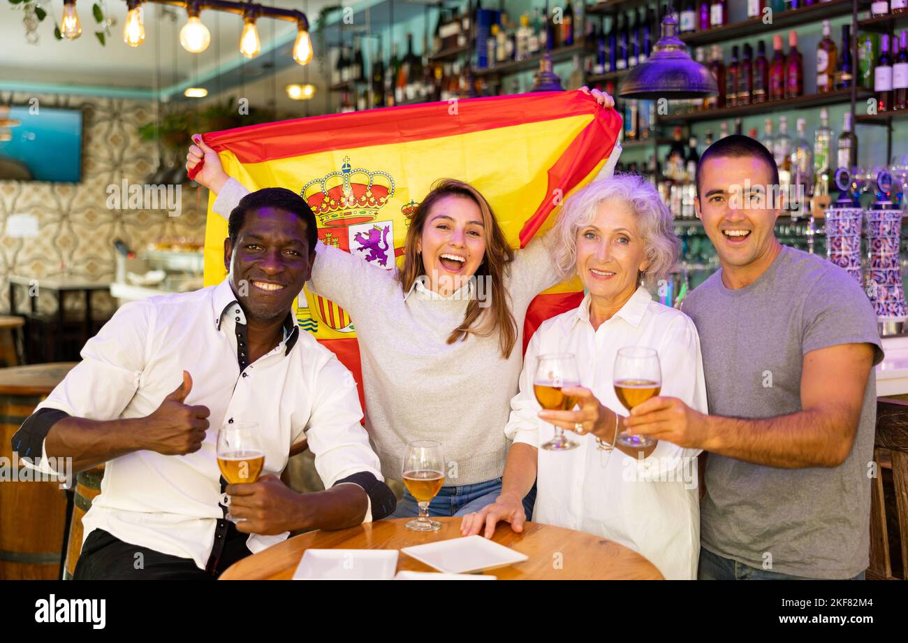 Happy fans celebrating the victory of Spanish team in bar Stock Photo ...