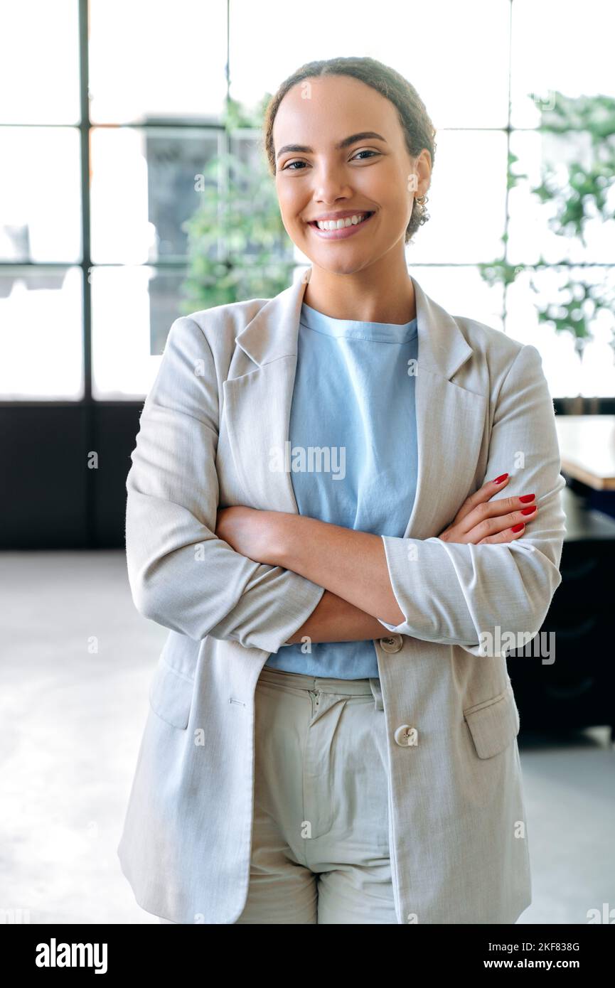 Vertical portrait of a confident beautiful elegant young mixed race ...