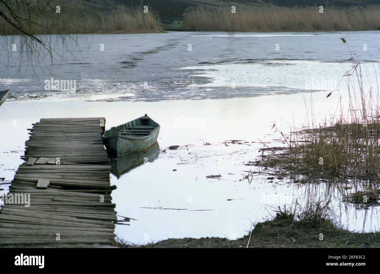 Ilfov County, Romania, 1990. Wooden boat by an old broken dock at ...