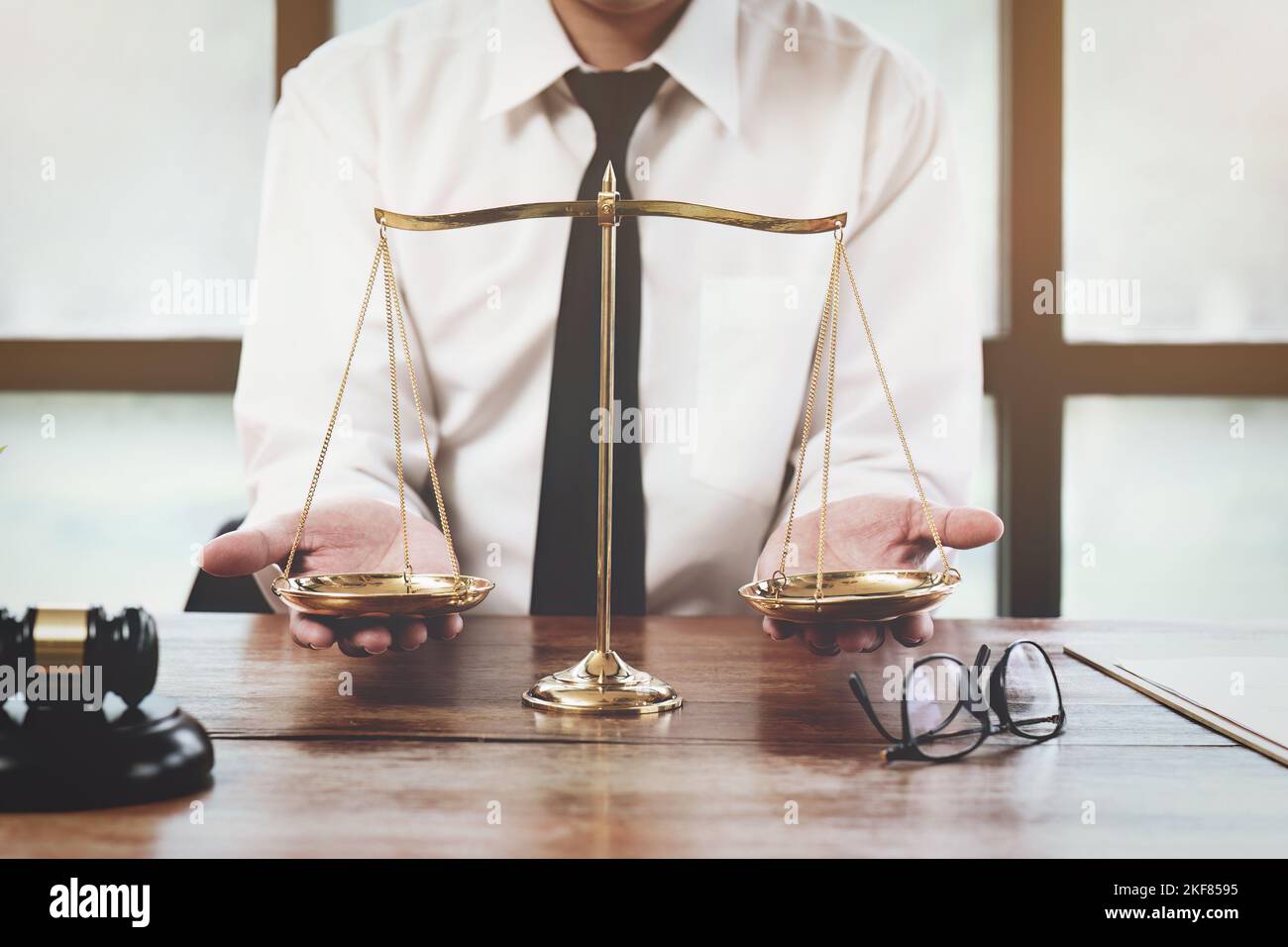 A judge or lawyer holds a scale of justice Stock Photo - Alamy