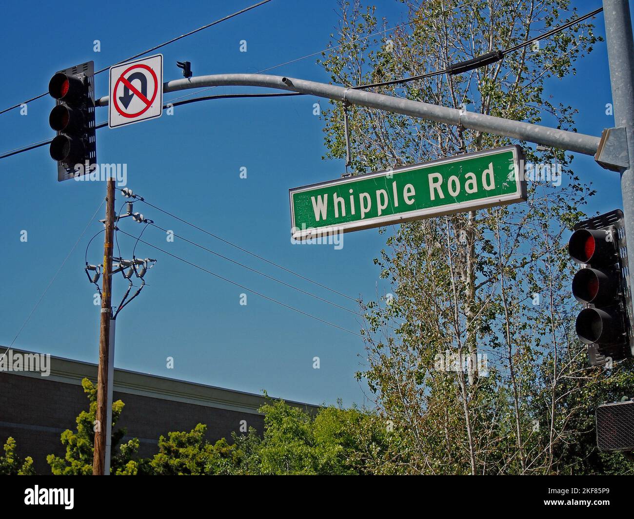 red traffic lights, no U turn sign, Whipple Ave street sign at ...