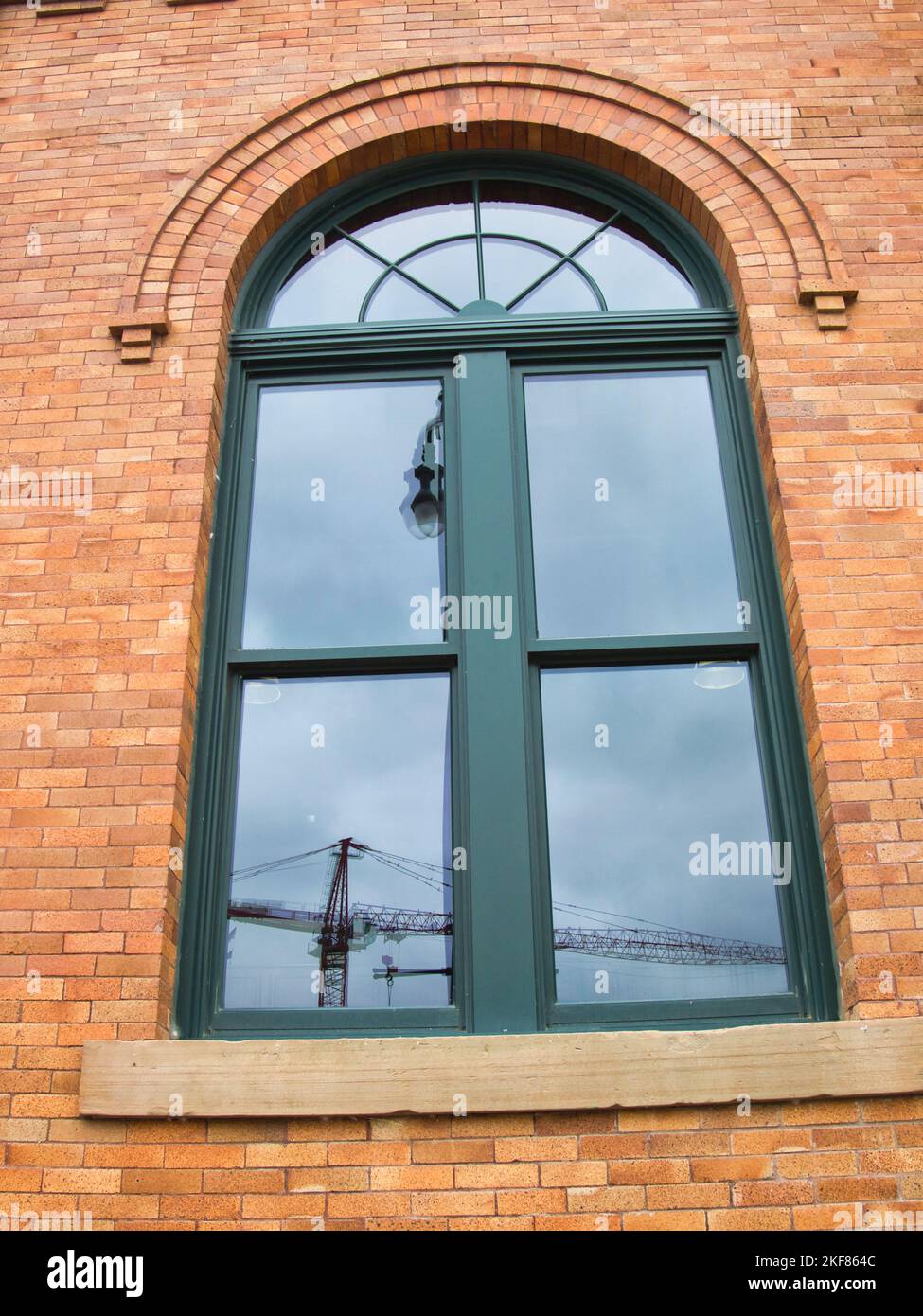 Tower crane reflected in a window Stock Photo - Alamy