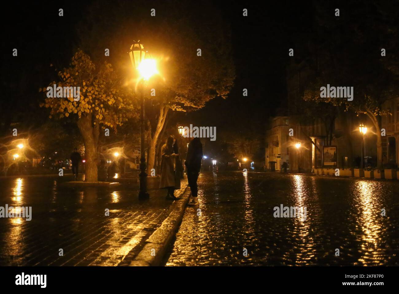 Standing under street lamp hi-res stock photography and images - Alamy