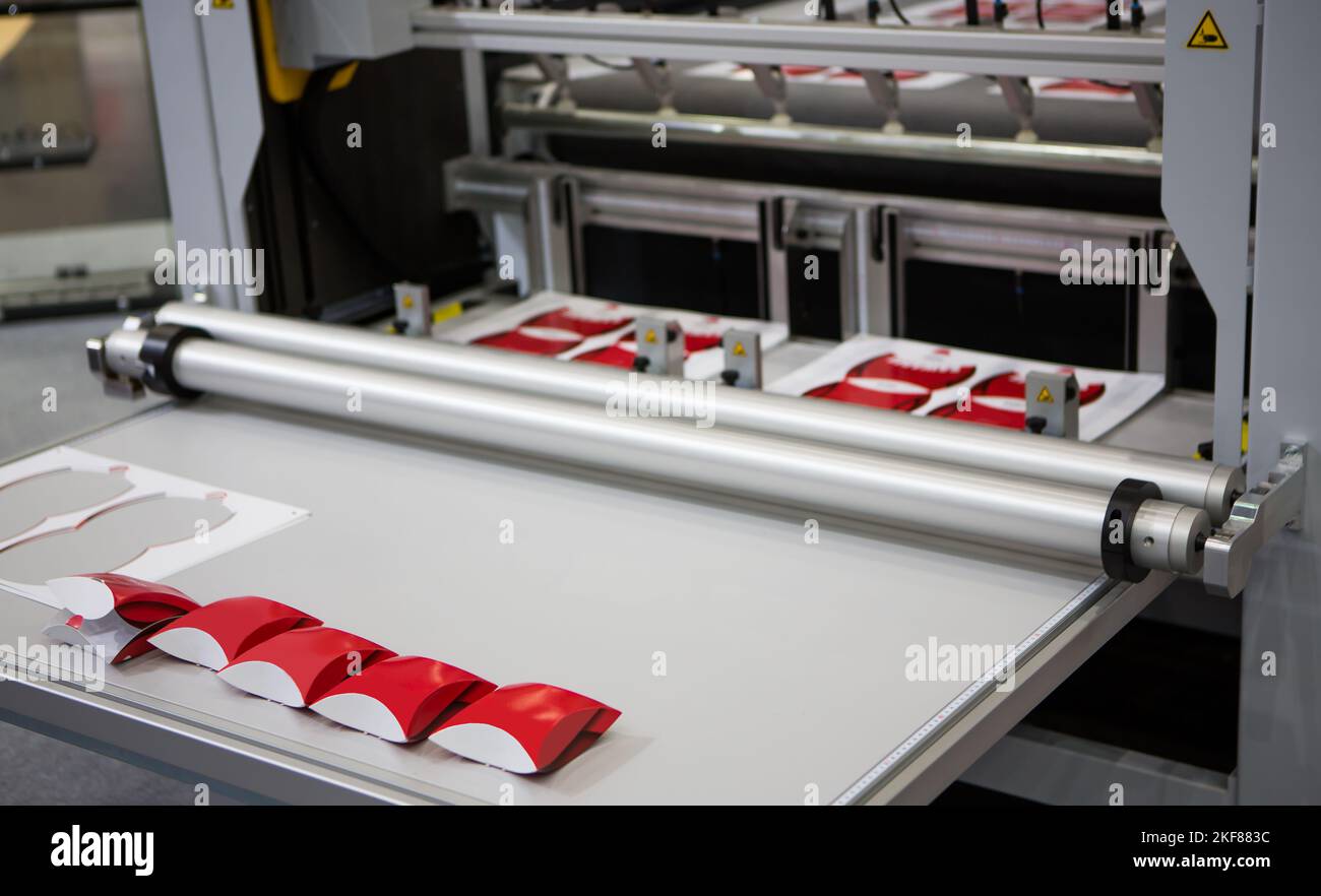 Digital cutting machine. Food folding packaging process on digital ...