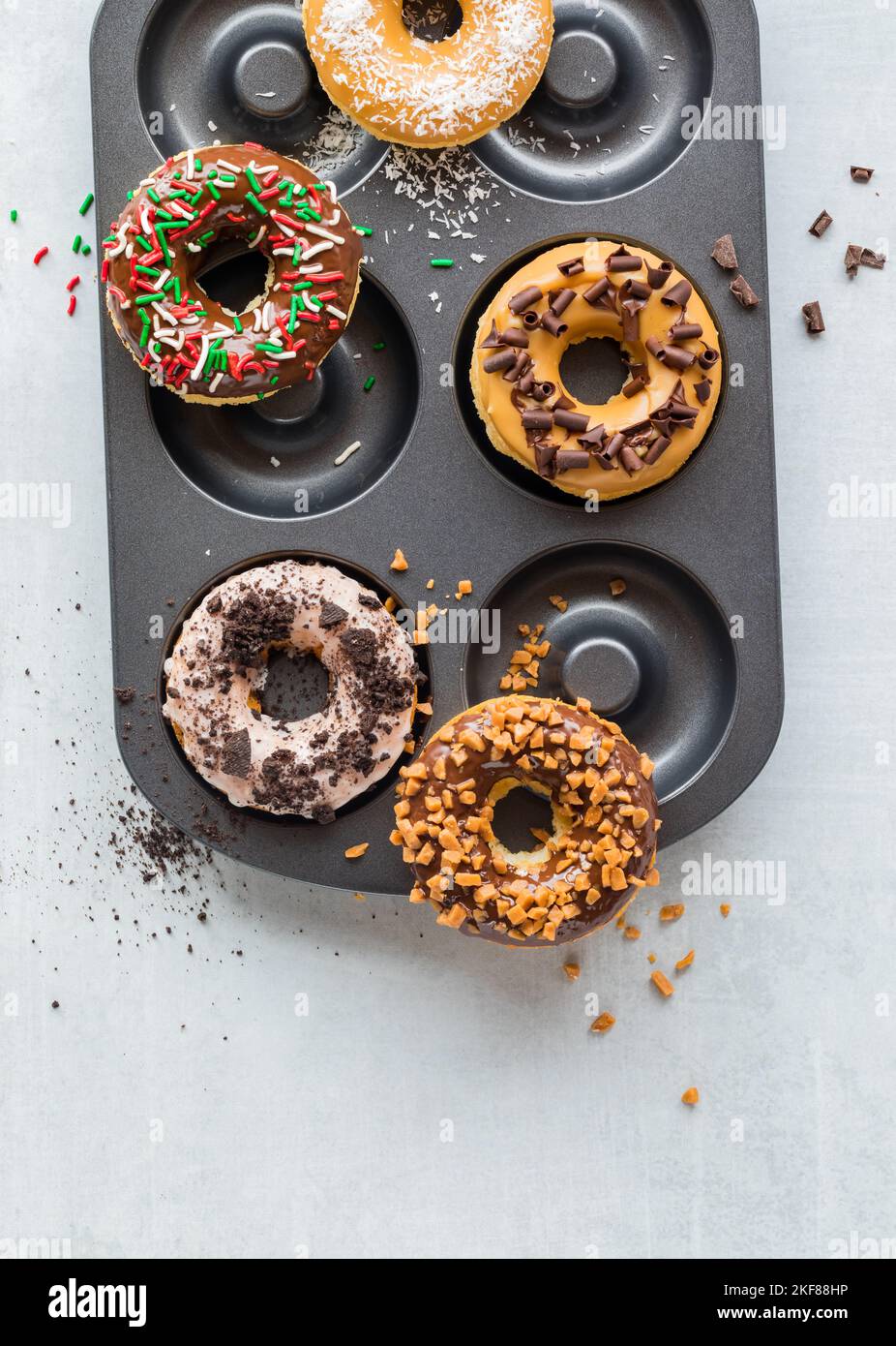 Top down view of a pan of delicious homemade donuts with copy space ...