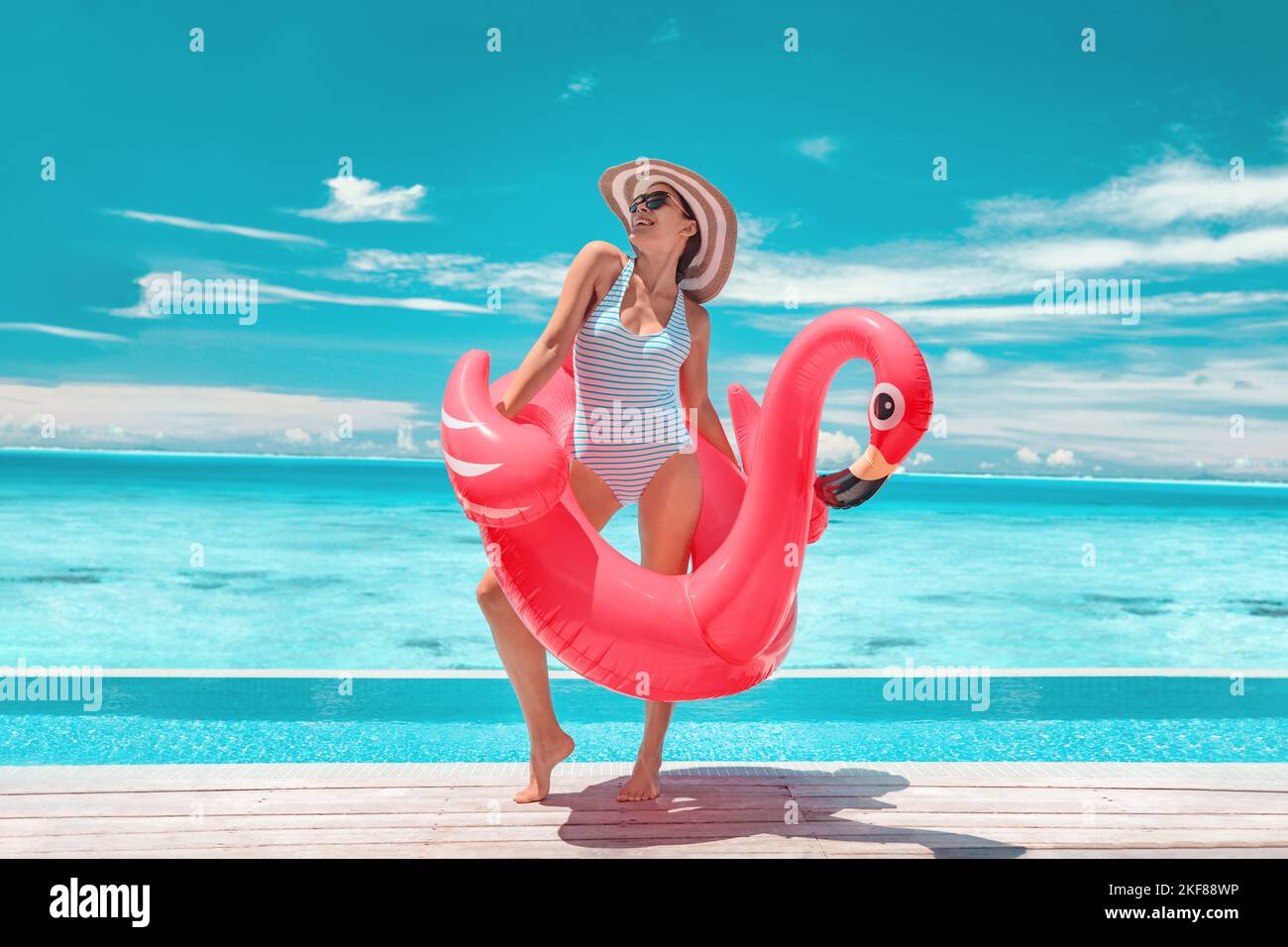 Woman sunbathing by swimming pool hi-res stock photography and images ...
