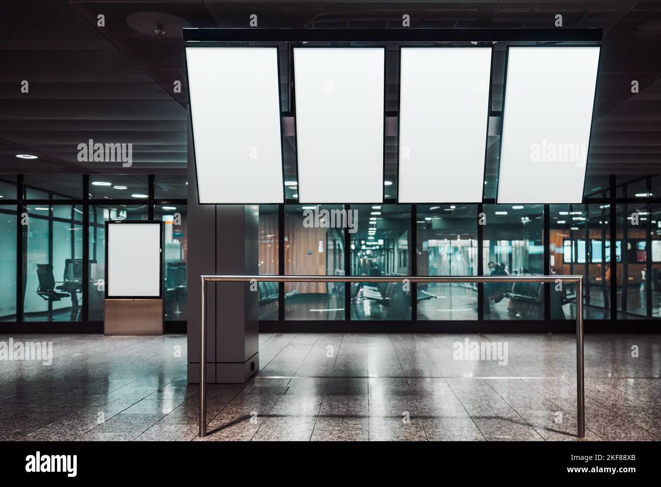 Four vertically oriented blank mock-ups of tv screens of a departure ...