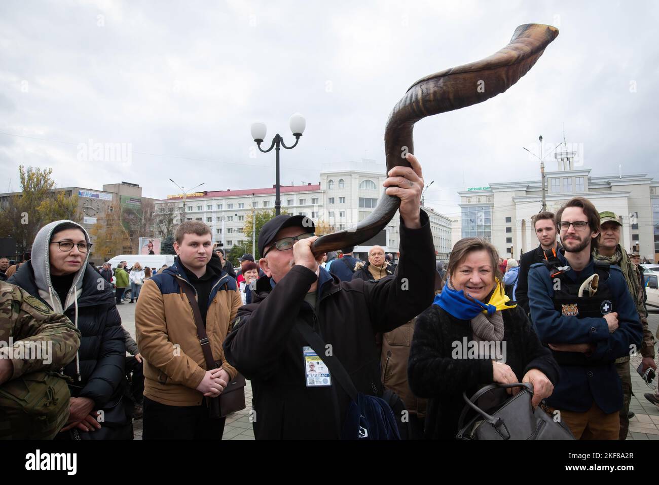 Kherson, Ukraine. 16th Nov, 2022. A local resident blows a ram's horn ...