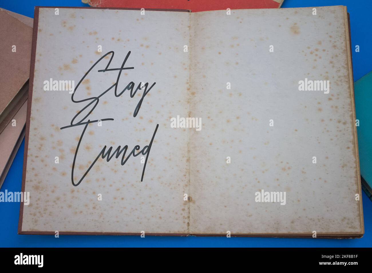 Stay Tuned word in opened book with vintage, natural patterns old ...