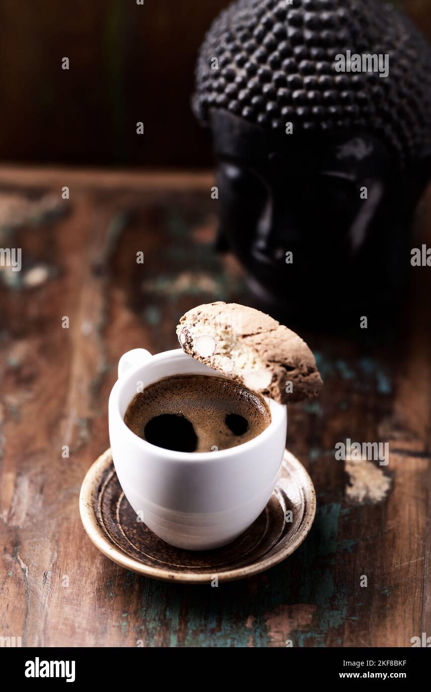 Cup of coffee and Cantuccini (Italian cookie) on dark wooden background ...