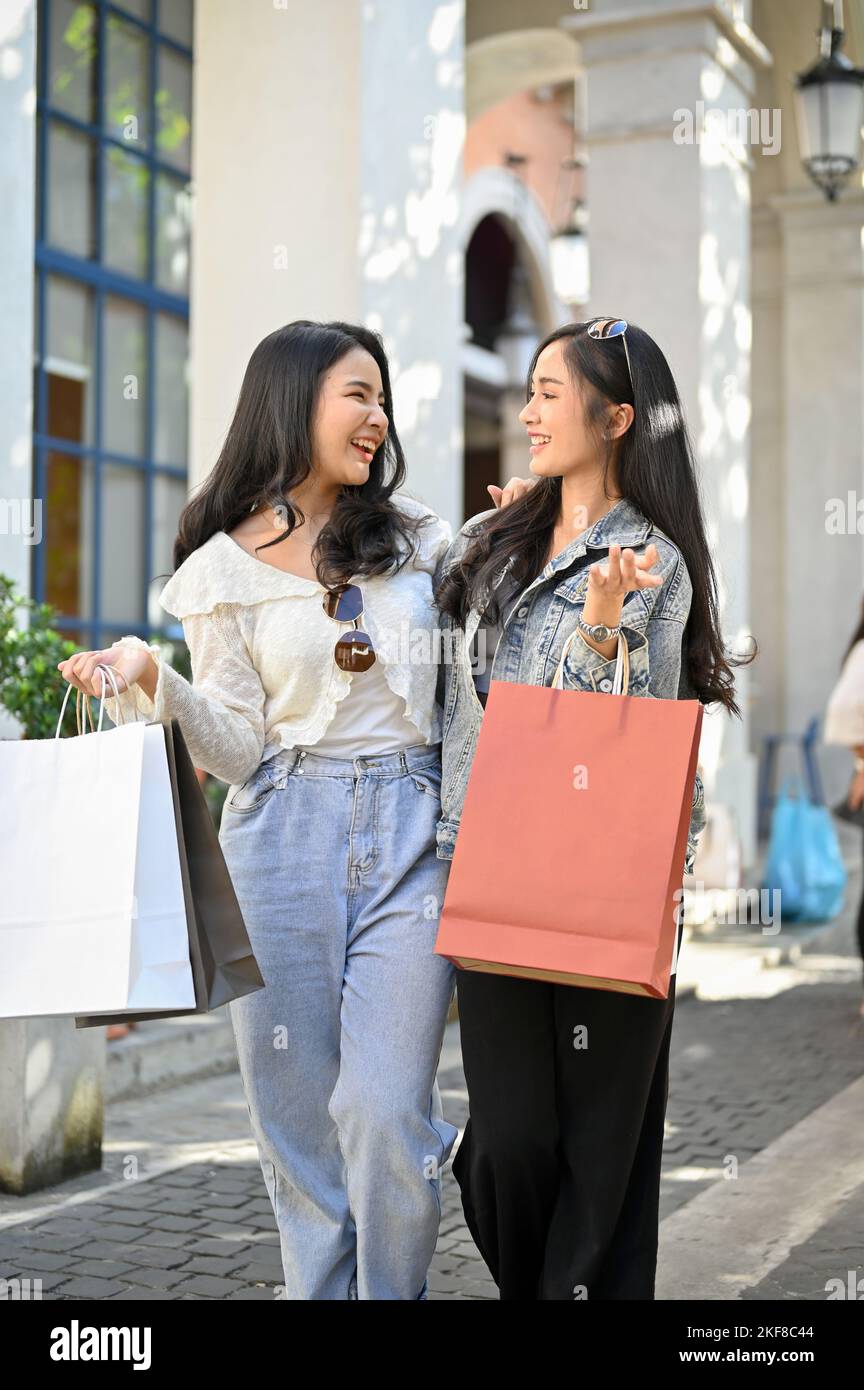 Portrait, Attractive and joyful Asian women having fun shopping time ...