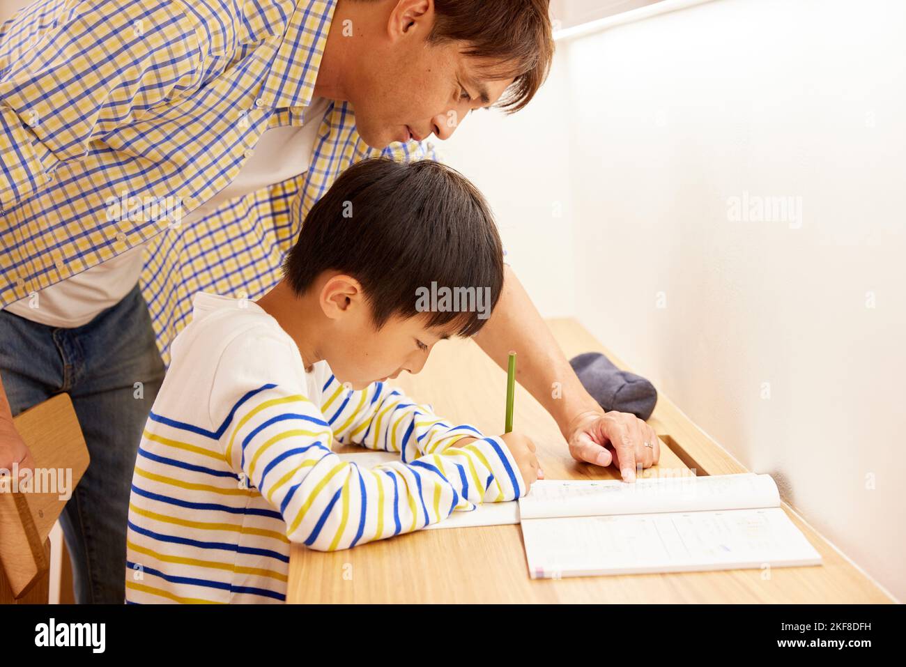 Mature asian student writing hi-res stock photography and images - Alamy