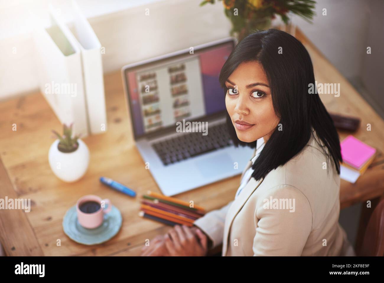 Putting in the effort for success. Portrait of a woman working at her ...