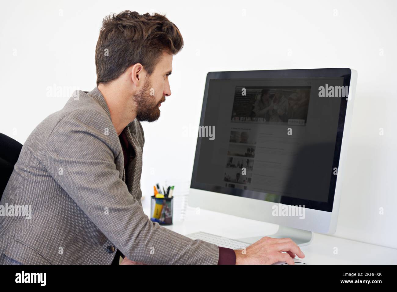 Designing websites with the customer in mind. a male designer working ...