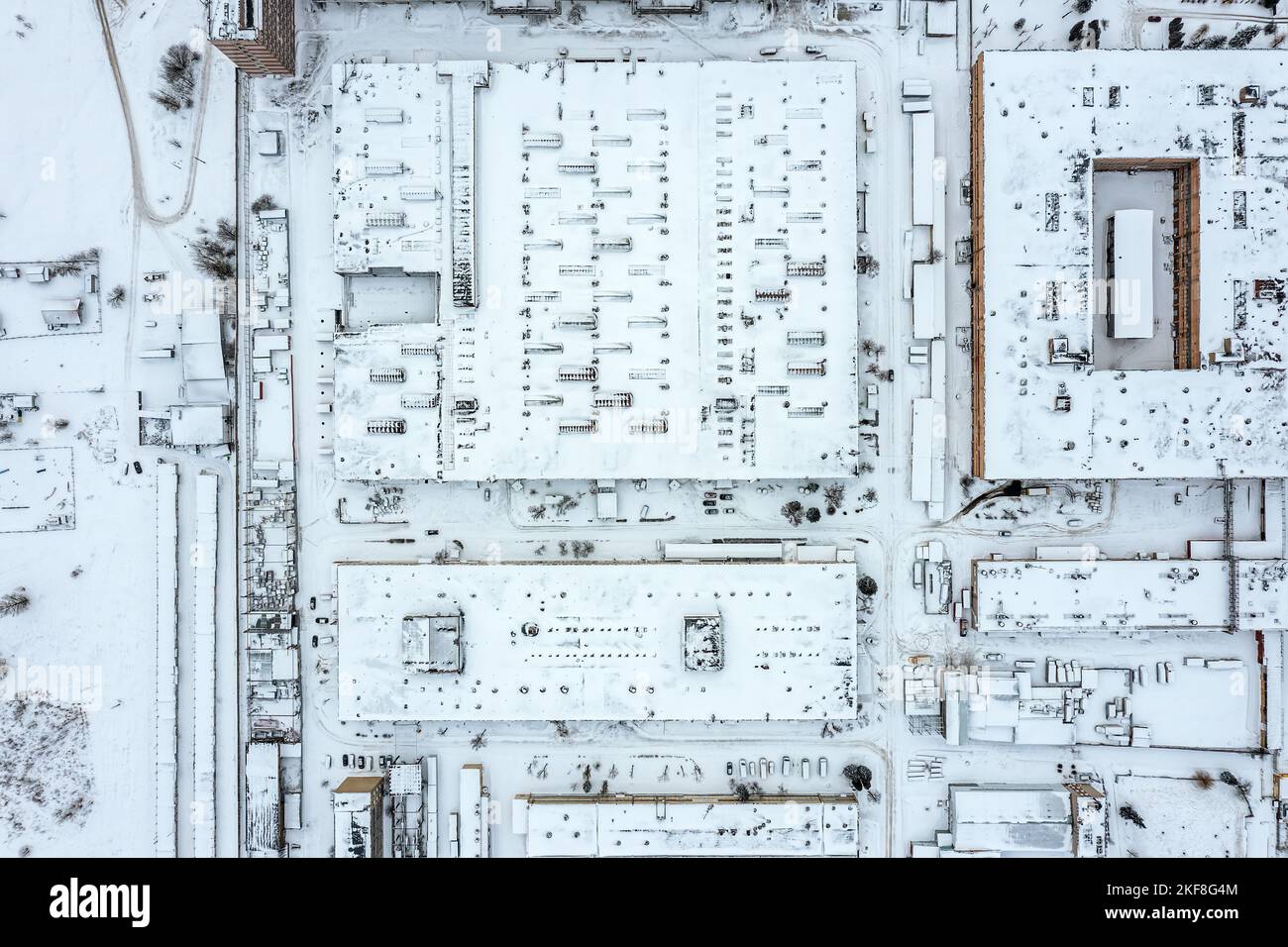aerial top view of industrial district in winter. manufacturing ...