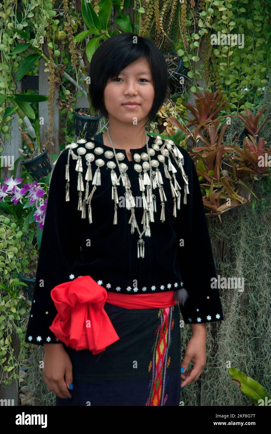 An unidentified Kachin or Jingpo young female in traditional dress ...