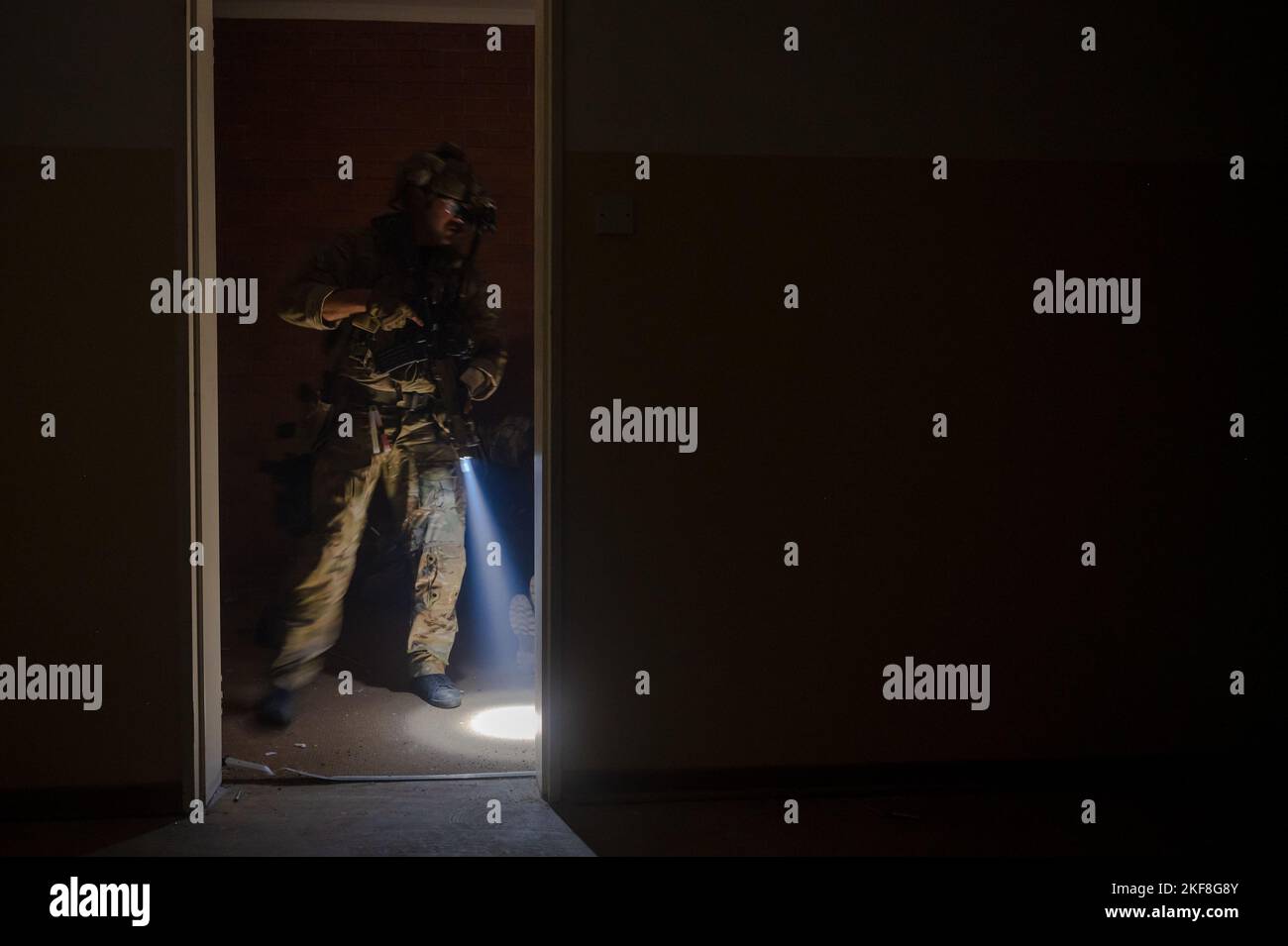 A U.S. Army Operational Detachment-Alpha (ODA) member searches a room ...