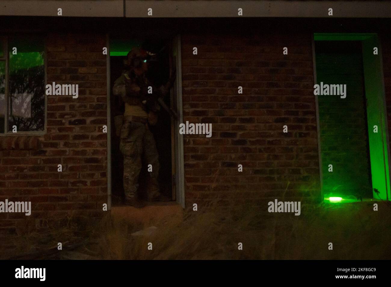 A U.S. Army Operational Detachment-Alpha (ODA) member guards the entry ...