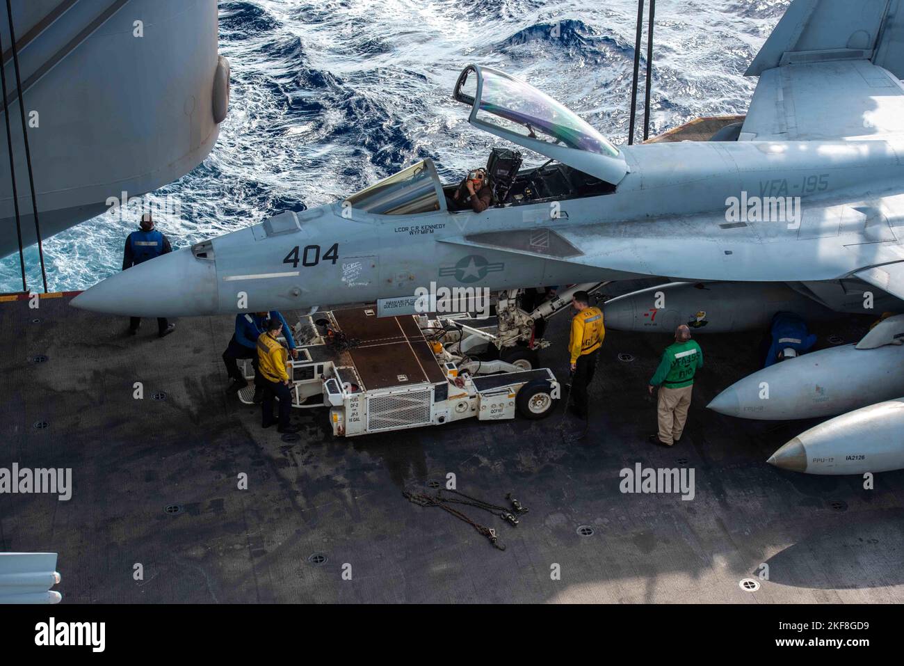 221116-N-LI114-1070 PHILIPPINE SEA (Nov. 16, 2022) Sailors move an F/A ...