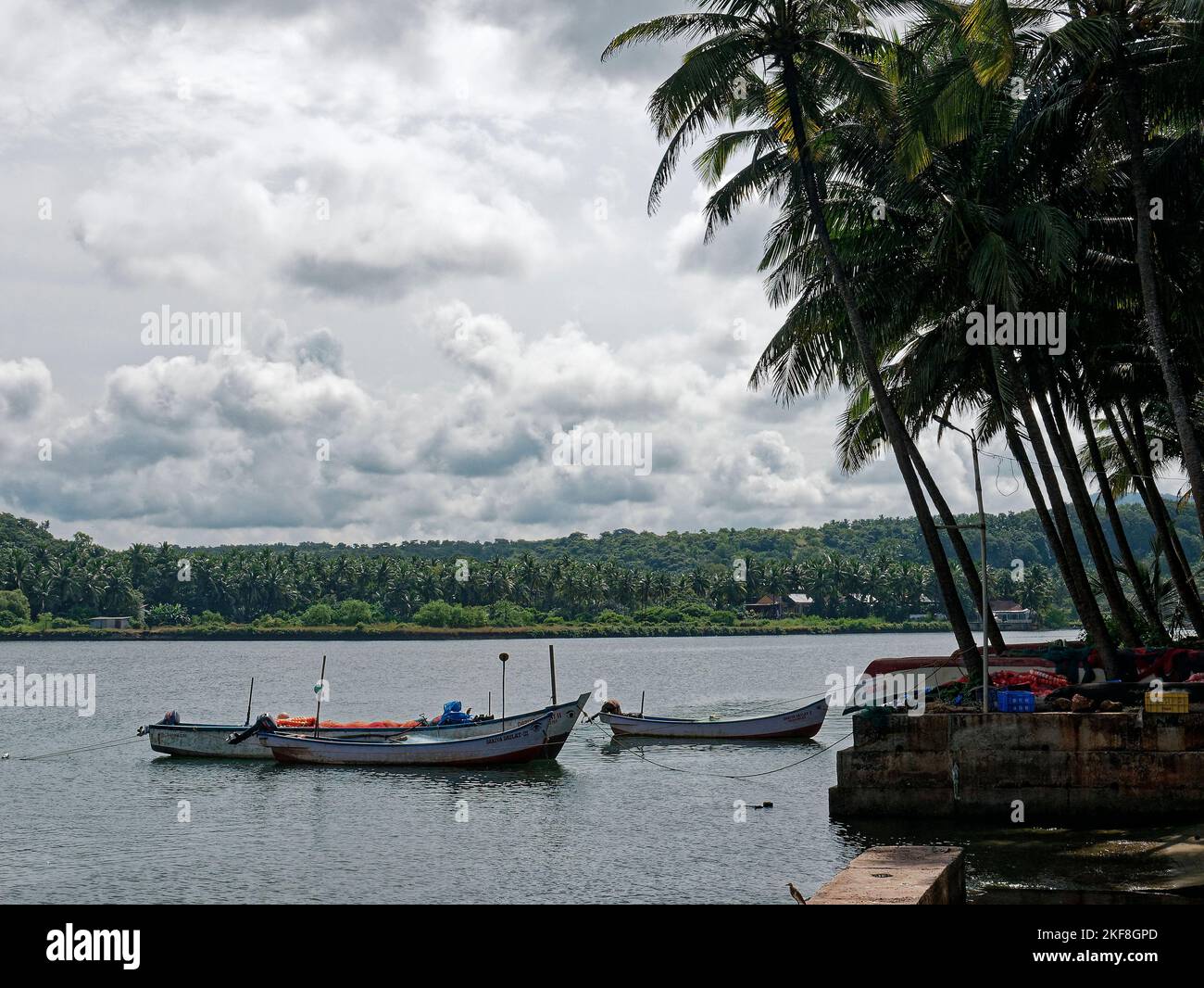 Traditional fishing boats parked near seashore at Betul state Goa India ...