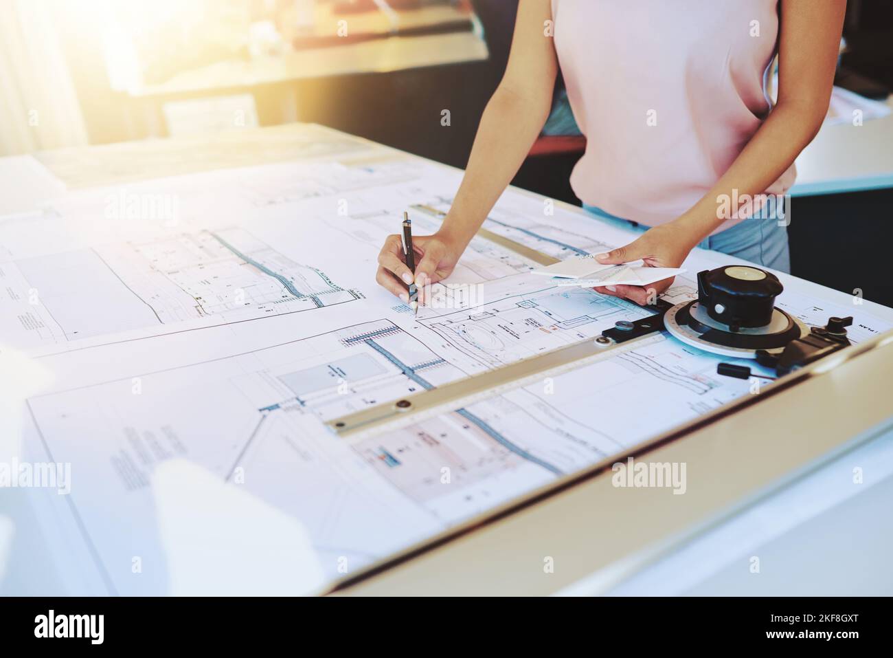 Architecture is an art form. an unrecognizable architect working on her ...