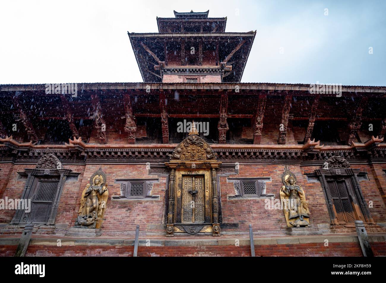 A low angle shot of an exterior of the Patan Museum against a cloudy ...