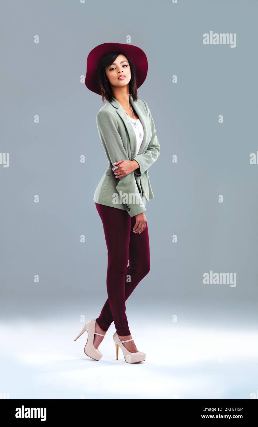Staying in vogue. Full length studio portrait of a stylish young woman ...