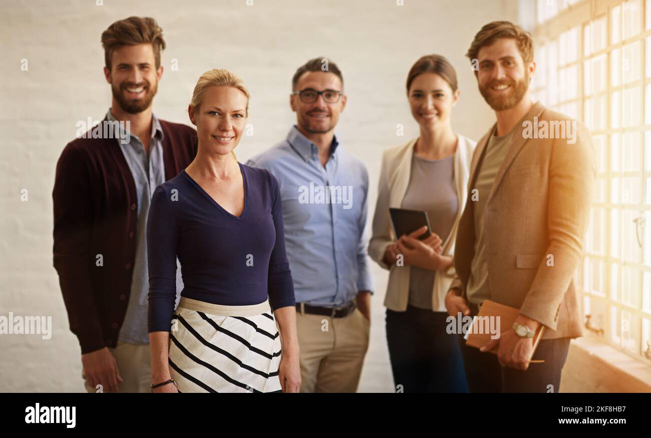 Well get the job done. Cropped portrait of a business team standing in ...