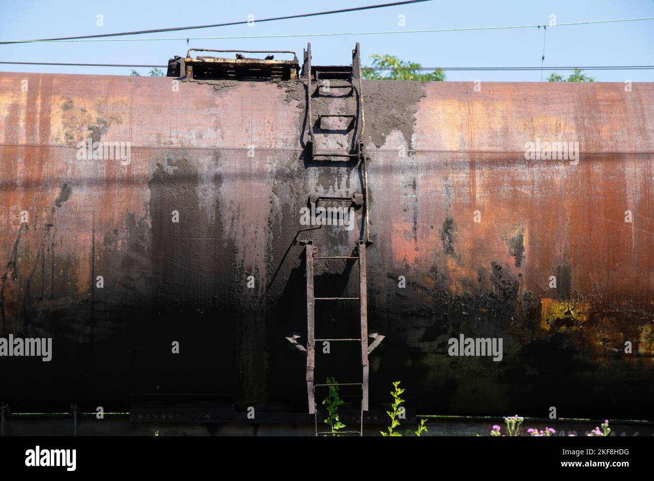 old decommissioned tank for oil transportation stands on the railway ...