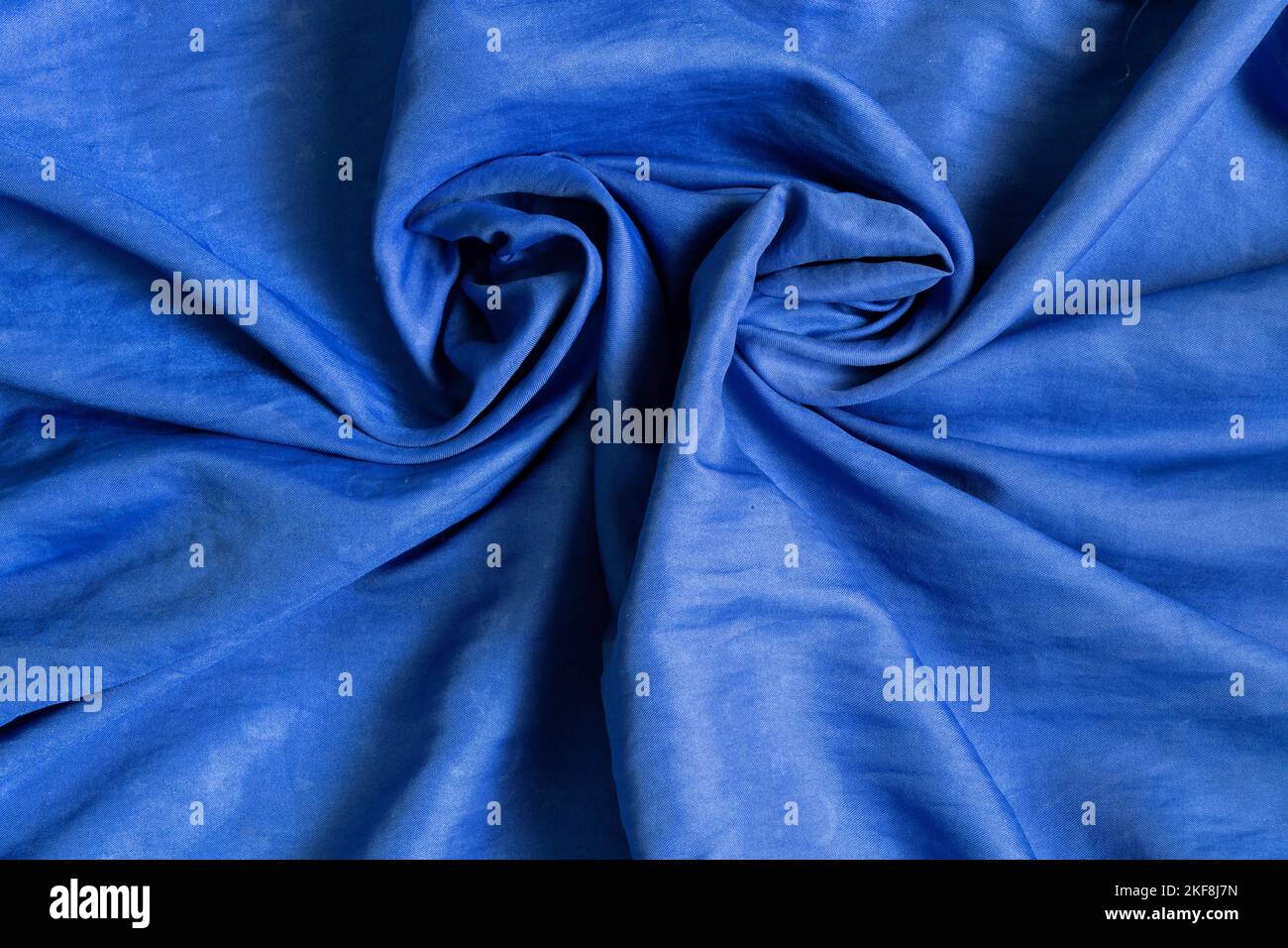 blue plain silk pleated fabric as background Stock Photo - Alamy